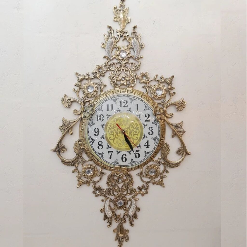 Luxurious Brass Wall Clock Featuring a Delicate Floral Hanging Accent ...